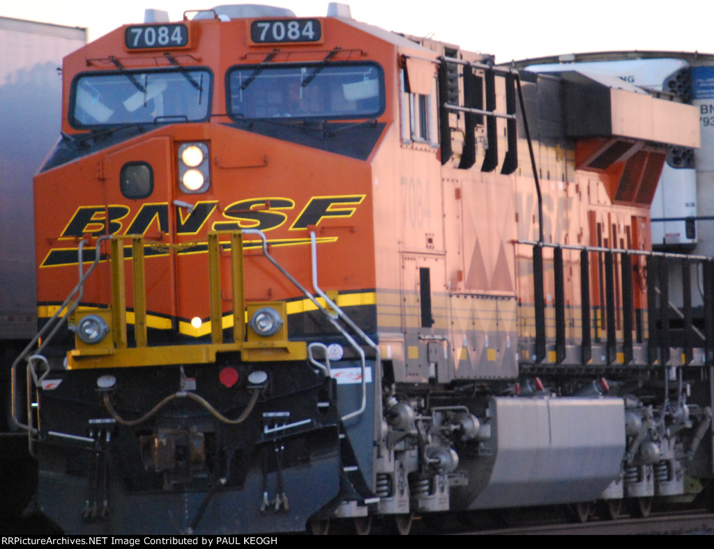 Up close of BNSF 7084 as she rolls west as a Rear DPU on a Manifest Train.